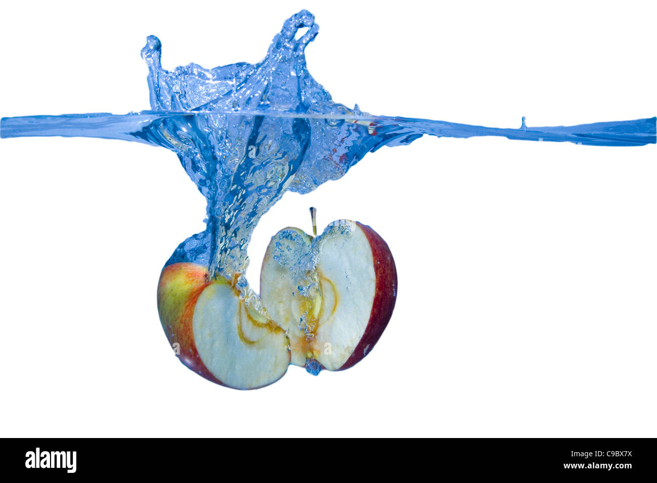Fruit splashing into water isolated on white background Stock Photo - Alamy