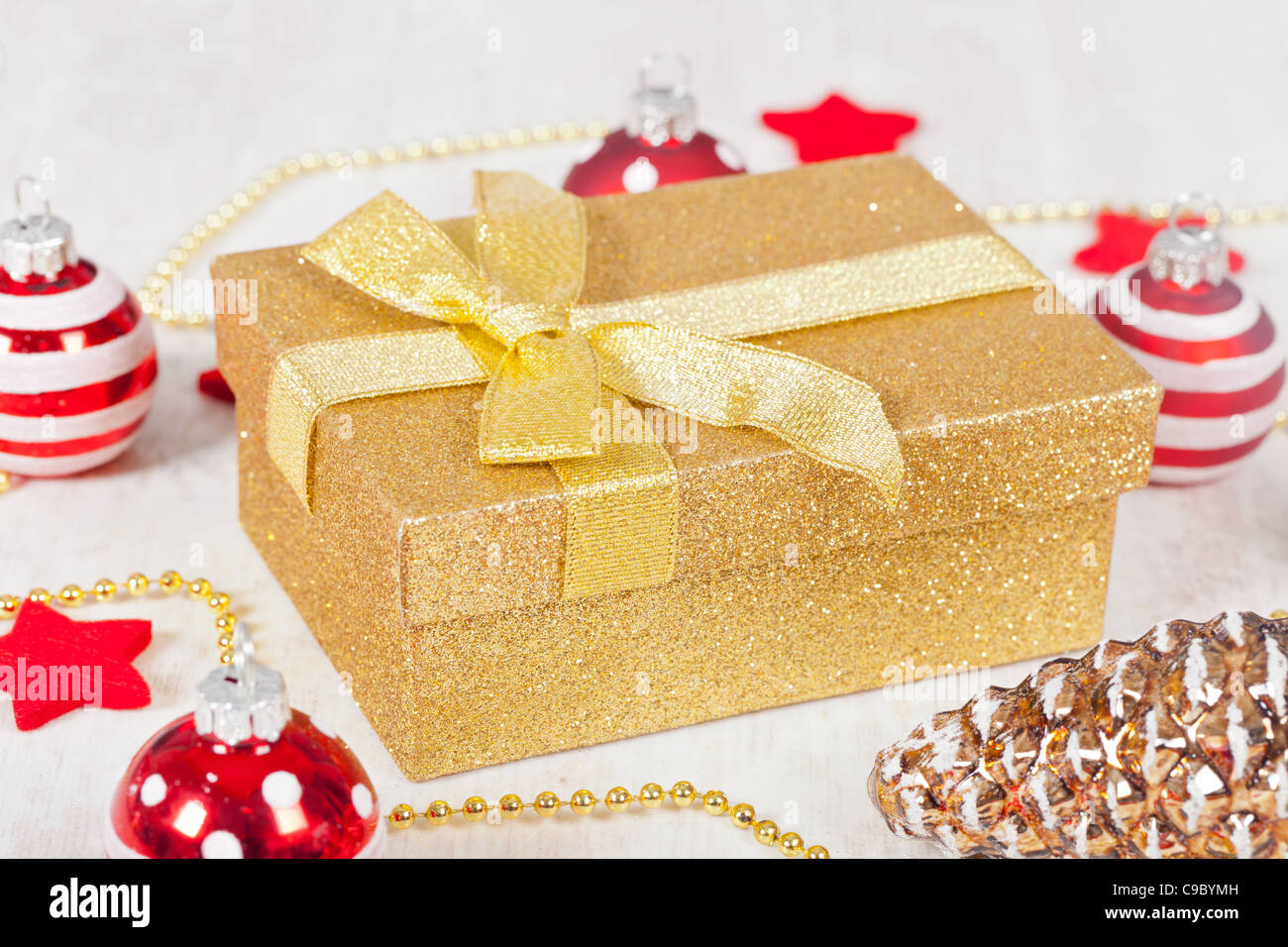 Elegant golden christmas gift pack and decorations Stock Photo - Alamy