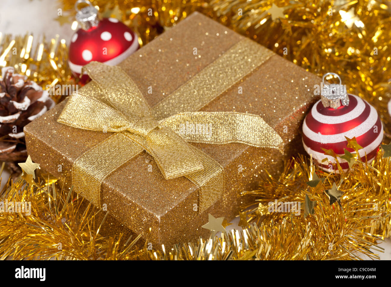Elegant golden christmas gift pack and decorations Stock Photo - Alamy