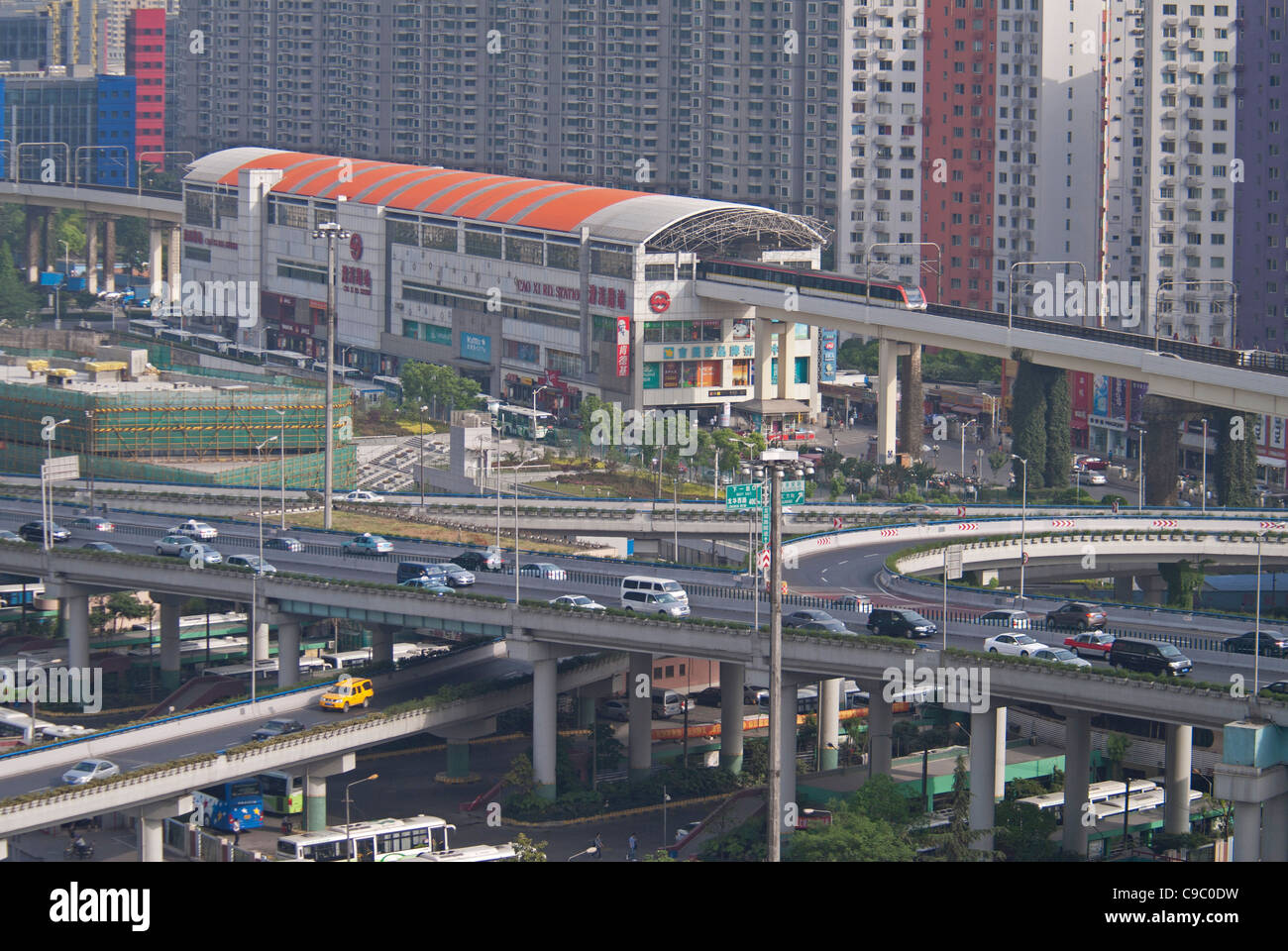China, Shanghai , Light Railway train leaving Caoxi Road station in ...