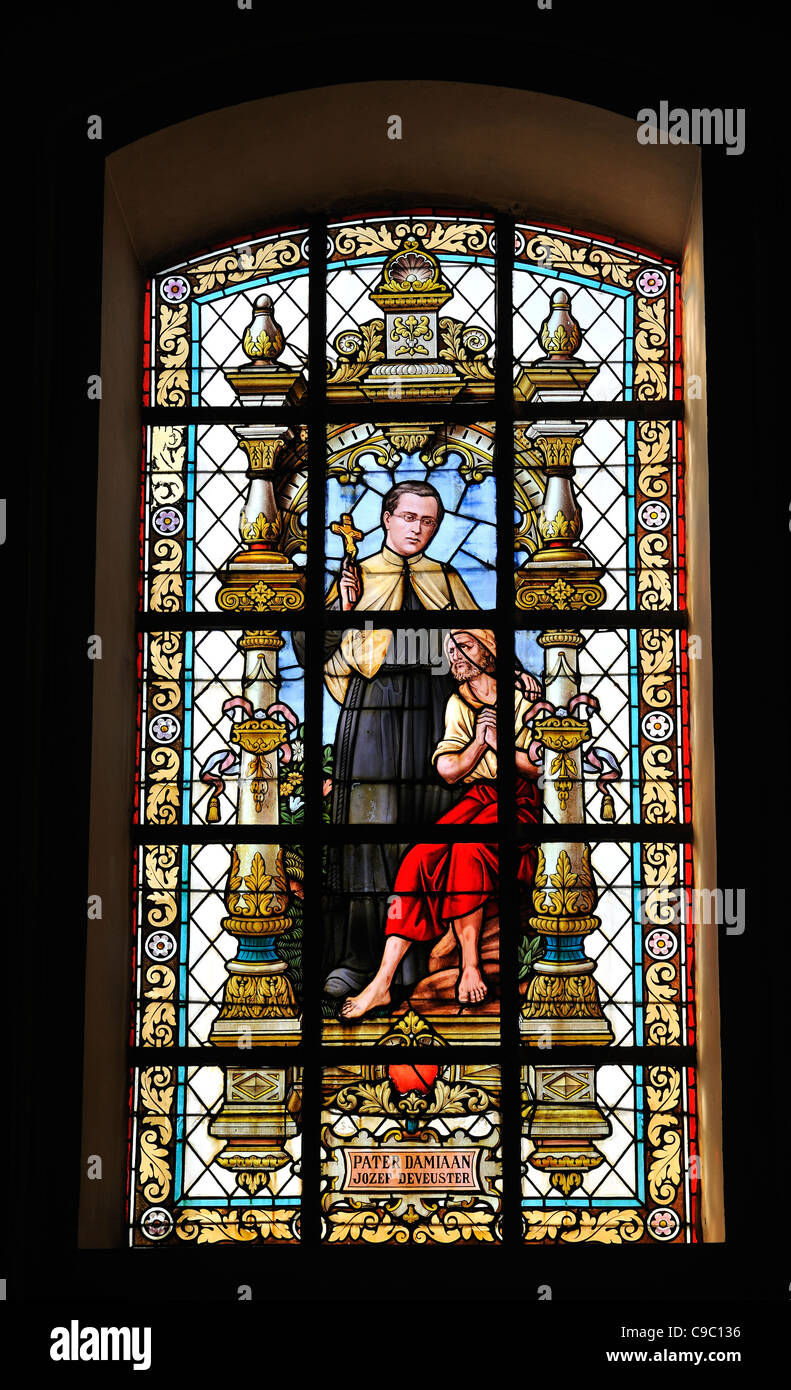 Stained-glass window in church at Tremelo, Belgium showing Father ...