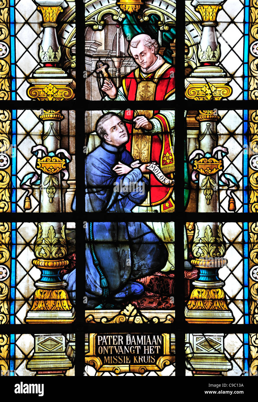Stained-glass window in church at Tremelo, Belgium showing Father ...