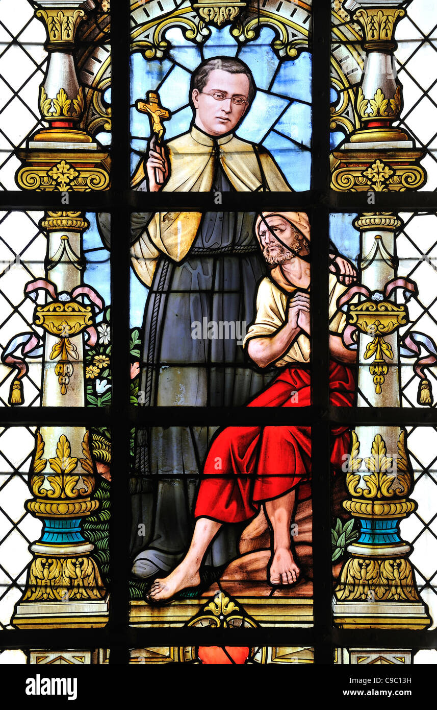 Stained-glass window in church at Tremelo, Belgium showing Father ...