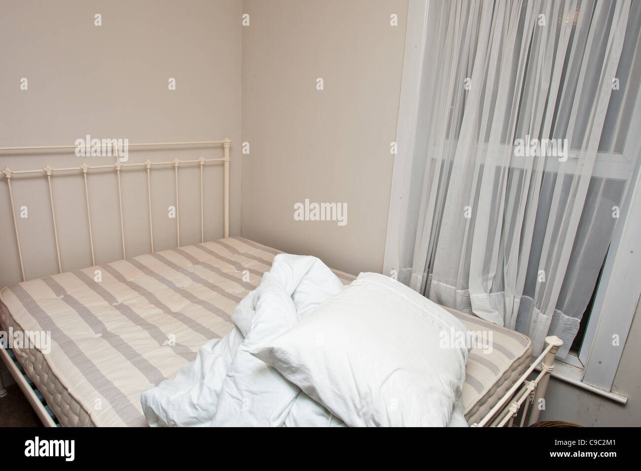 Double bed stripped for cleaning bed linen Stock Photo - Alamy