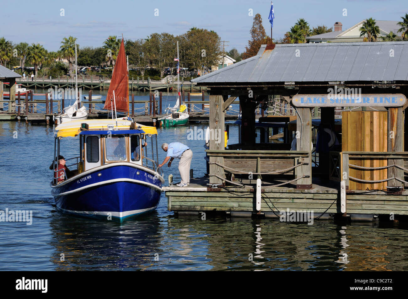 Lake Sumter Line ferryboat docking alongside the pier in The Villages ...