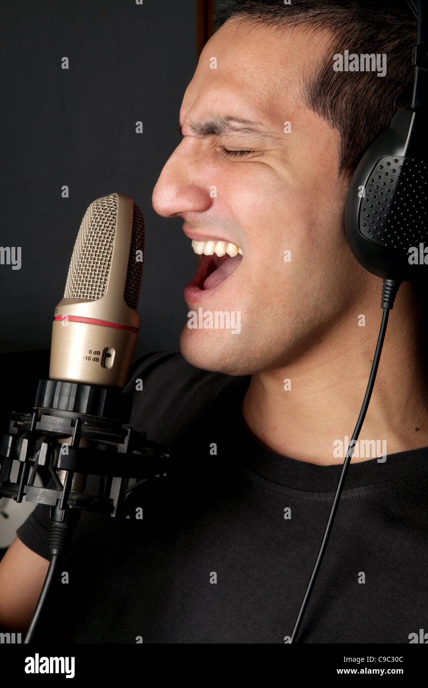 Rock star recording a song in a studio Stock Photo - Alamy