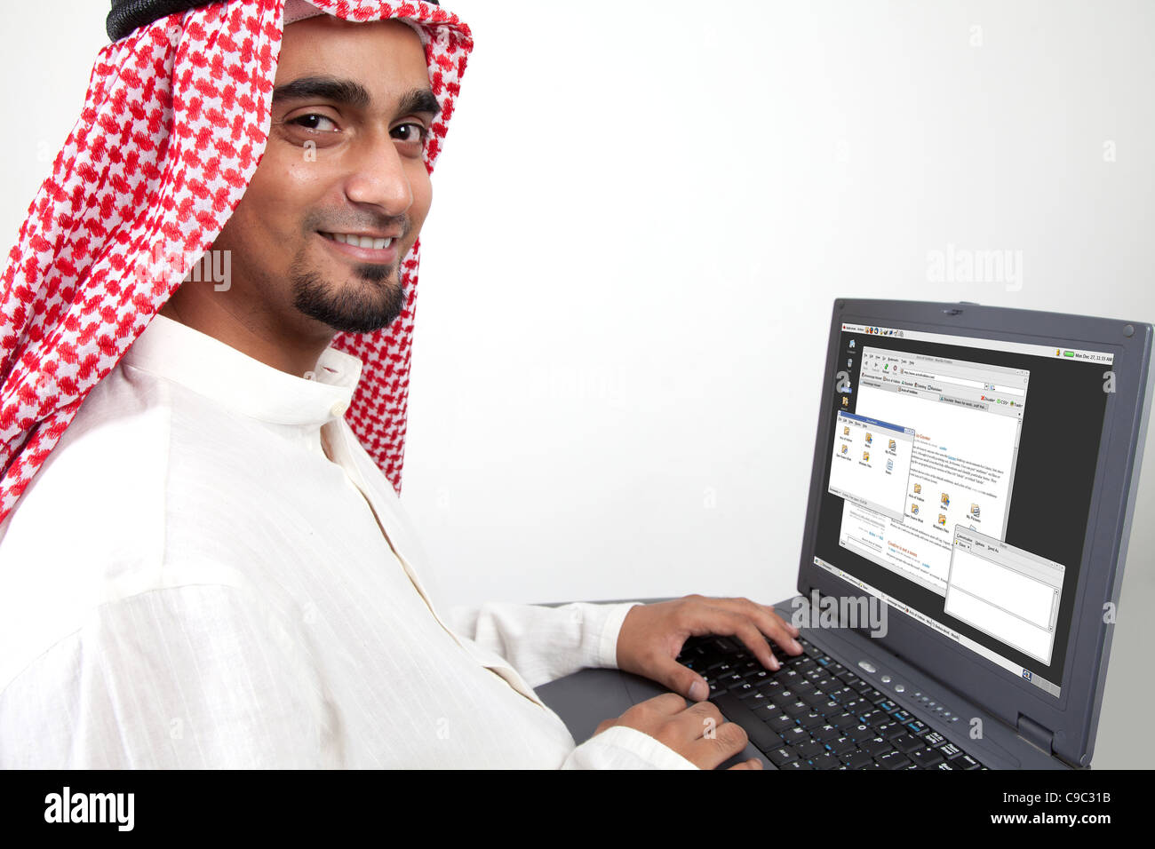 Arab sheikh working on a laptop Stock Photo - Alamy