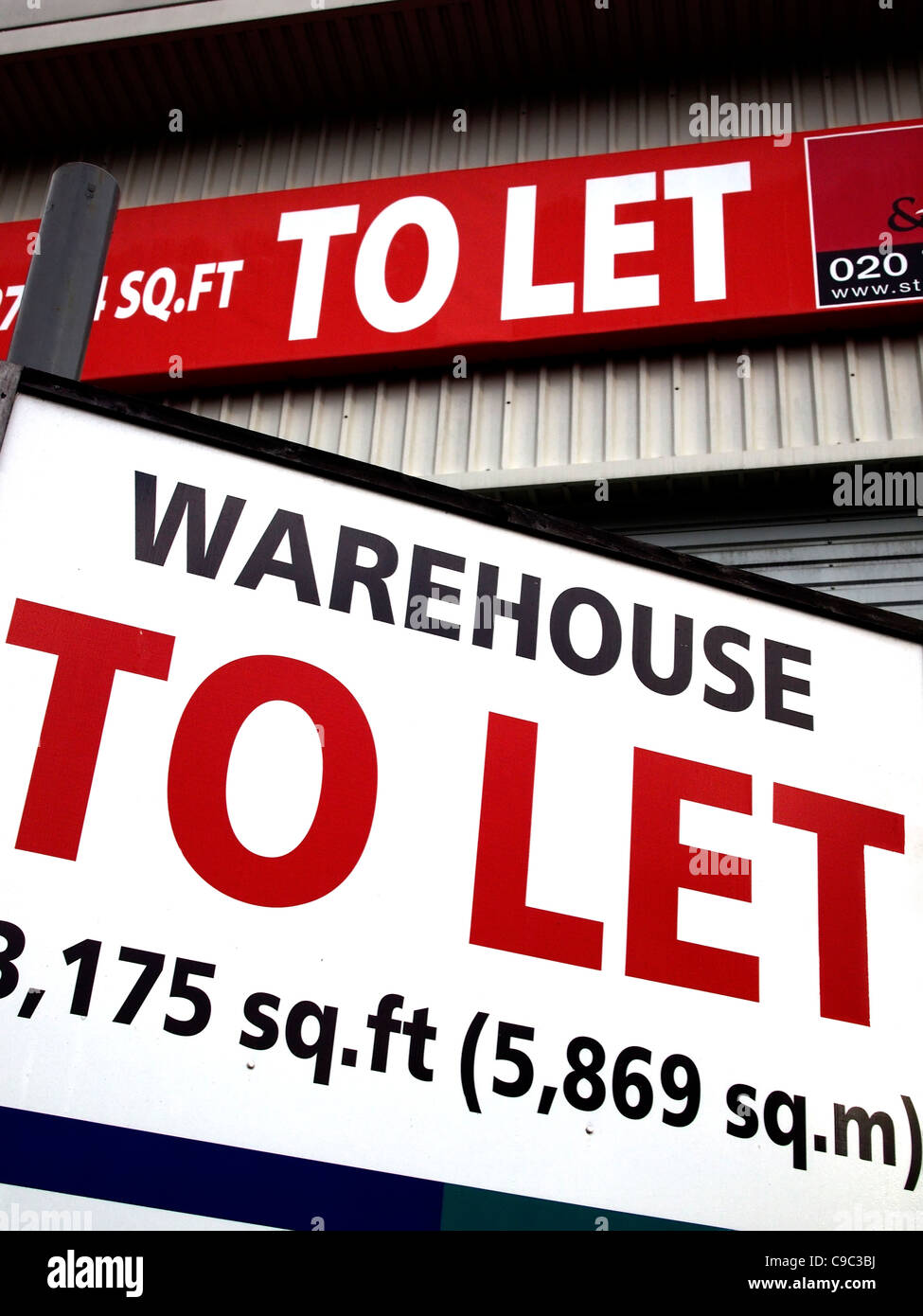 "To-let" signs outside a warehouse in England Stock Photo - Alamy