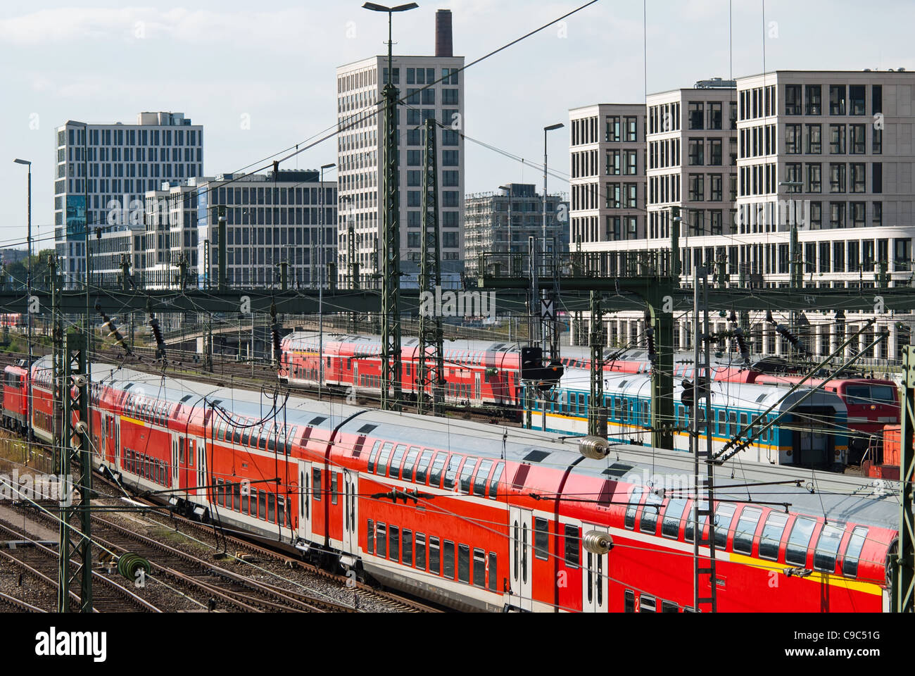 many trains in the railway station with houses in the background Stock ...