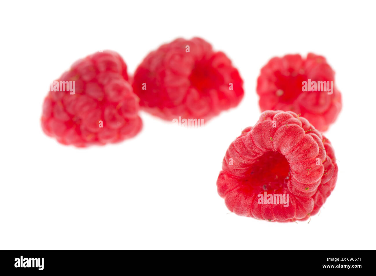 Fresh raspberries isolated over white background Stock Photo - Alamy