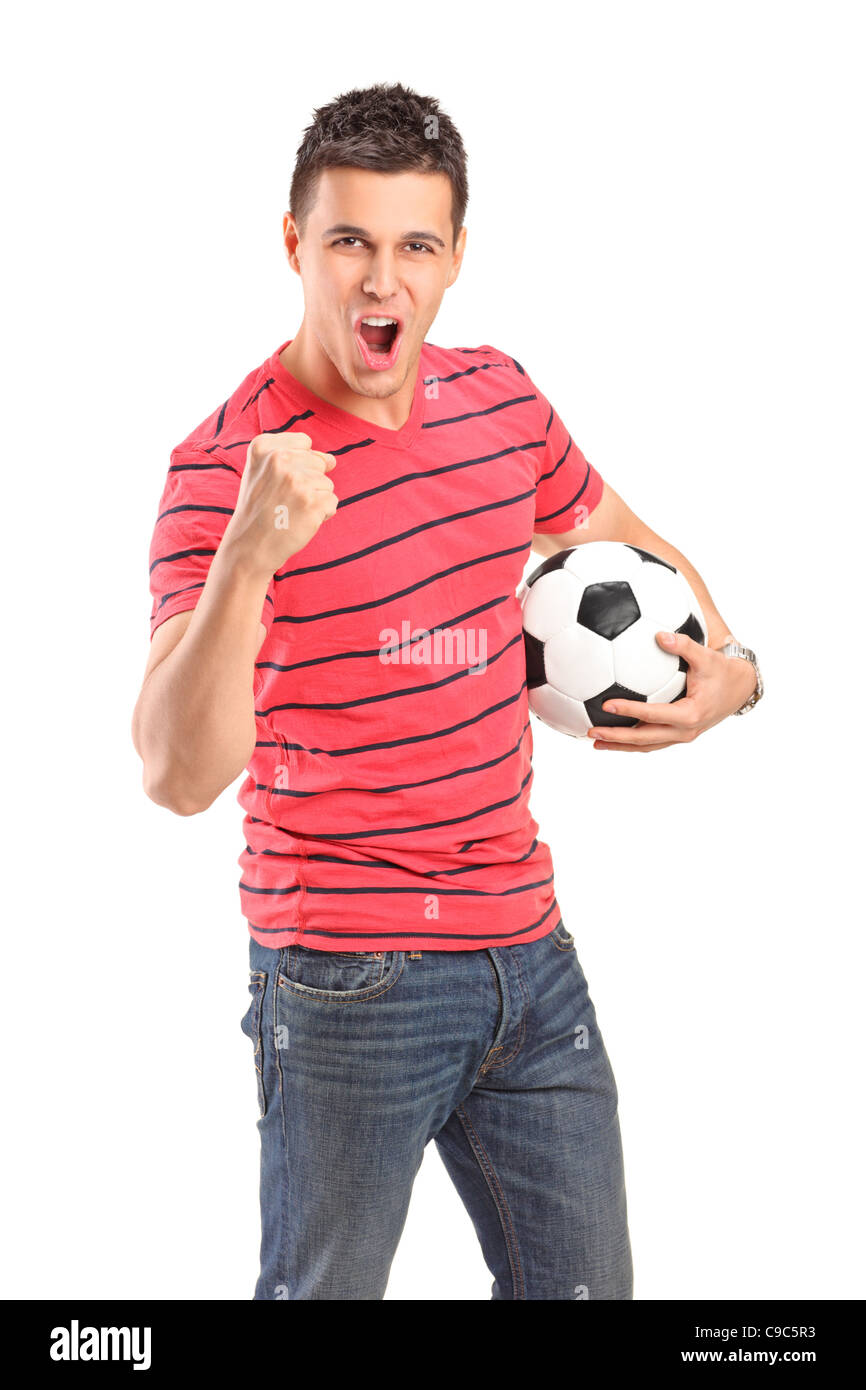 Young man cheering and holding a football Stock Photo - Alamy