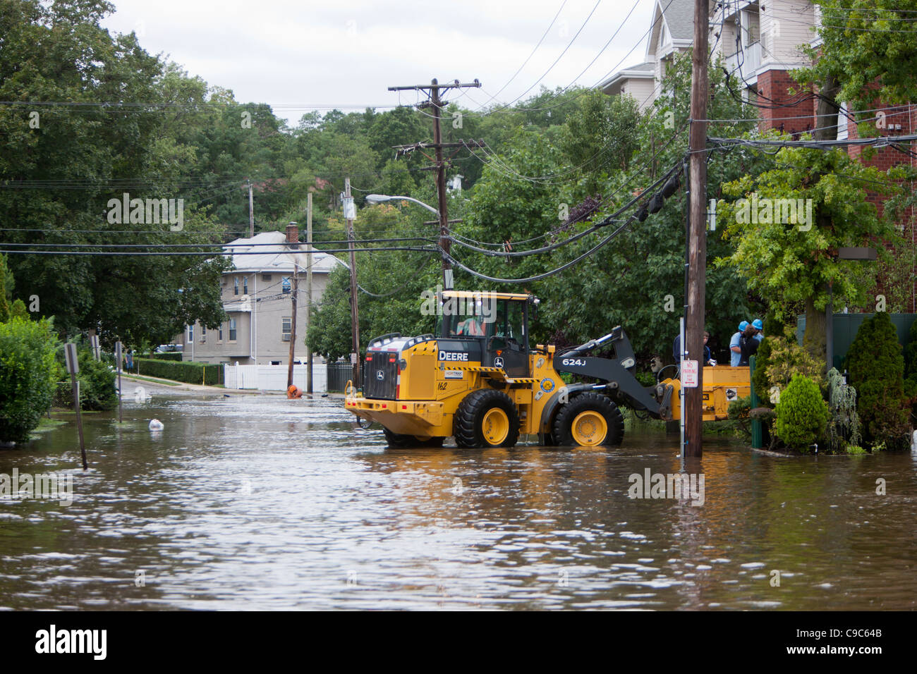 A Con Edison repair crew works on a transformer on Grand Street in the ...