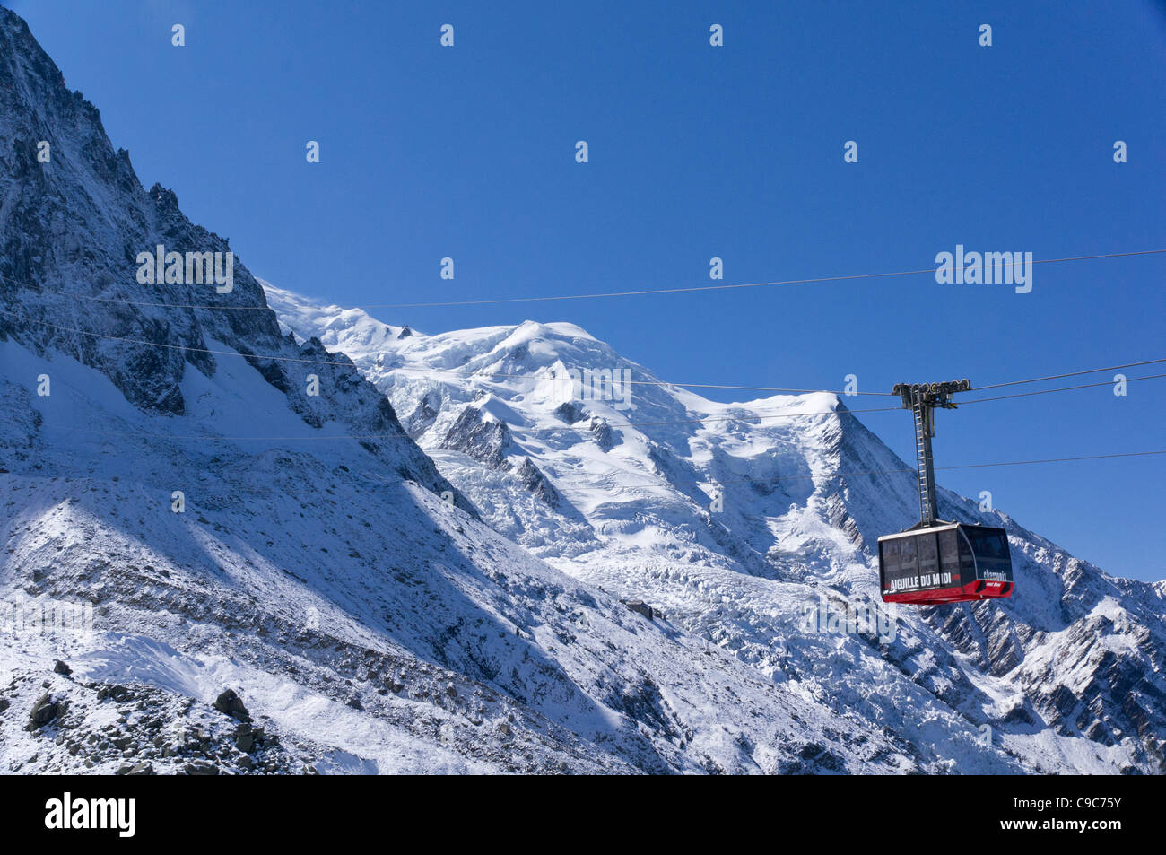 A cable car departs from the Plan de l'Aiguille for the final ascent to ...