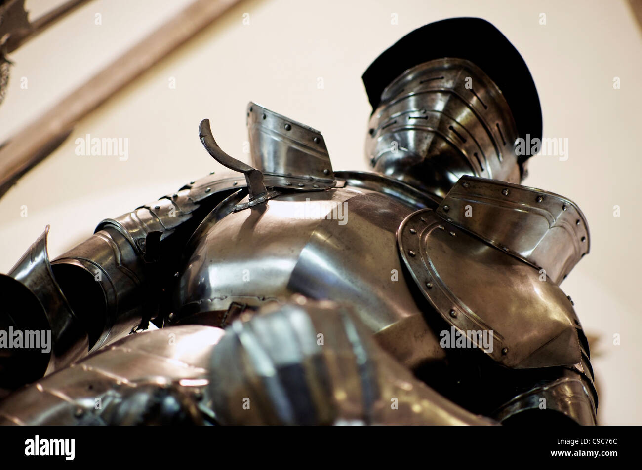 Powerful knight in iron armor seen from right below Stock Photo - Alamy