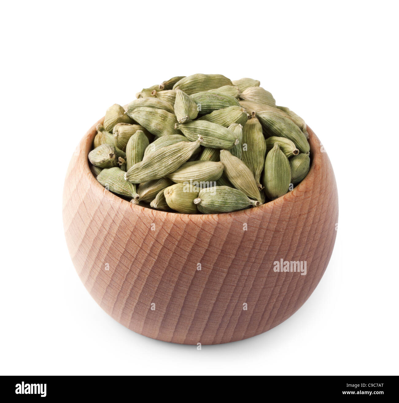 Wooden bowl full of cardamom seeds isolated on white background Stock ...