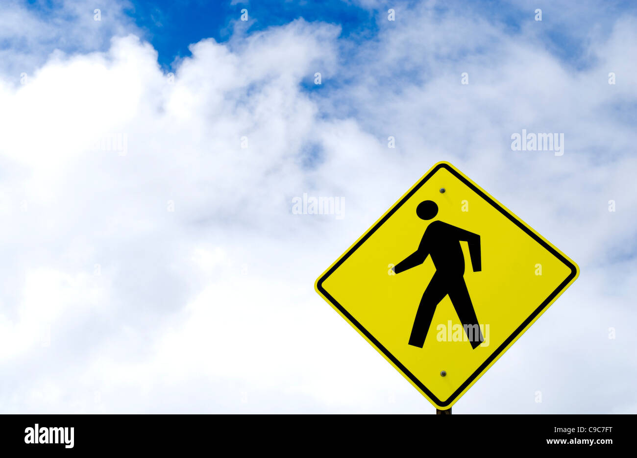 Pedestrian Crossing Sign Against Clouds and Blue Sky Stock Photo - Alamy