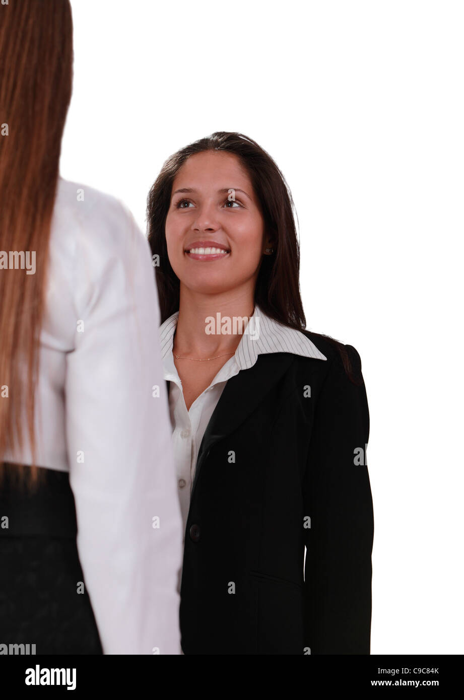 Two young women discussing isolated against a white background Stock ...