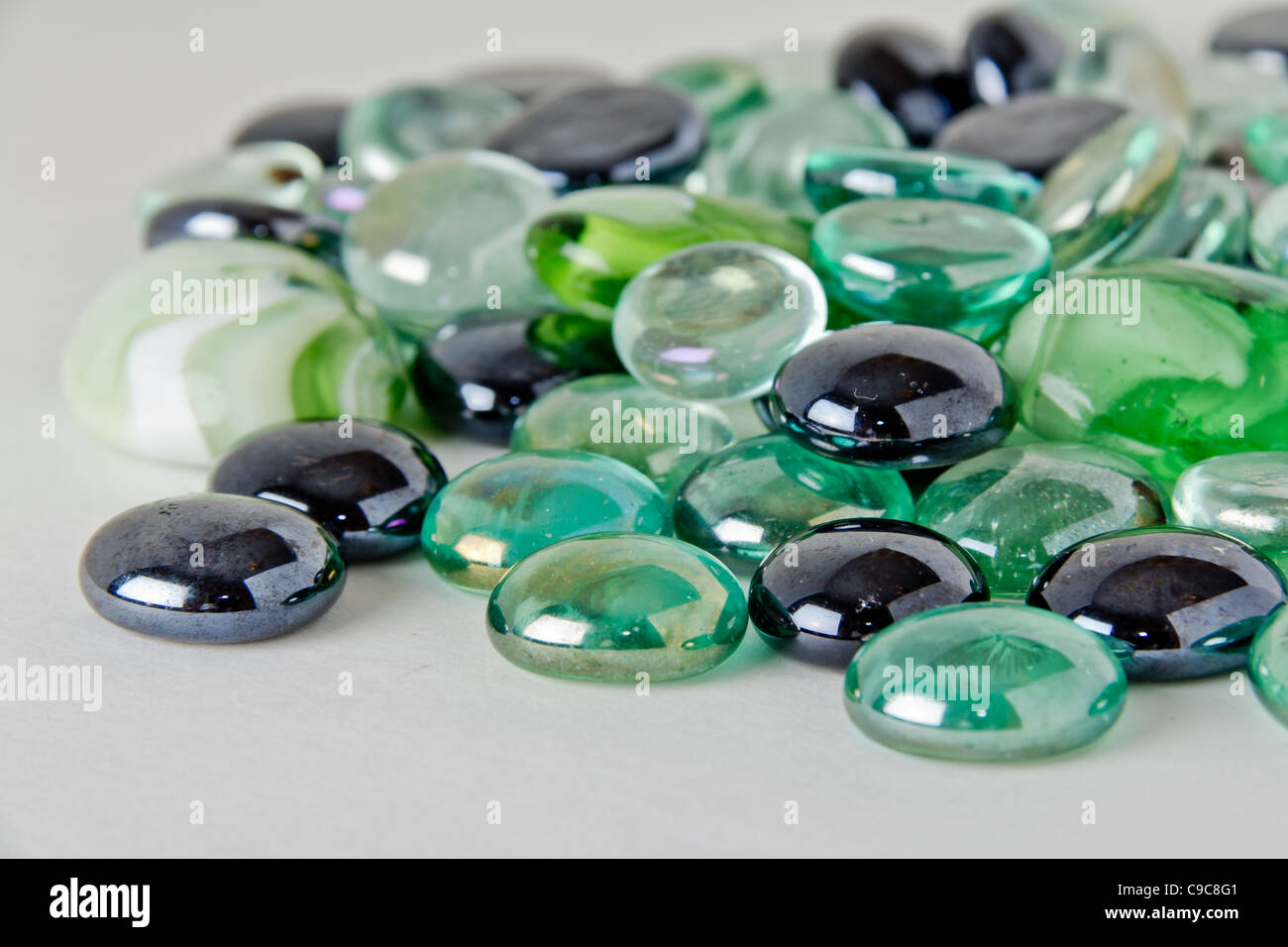Beautiful multi colored marbles on a plane background Stock Photo - Alamy