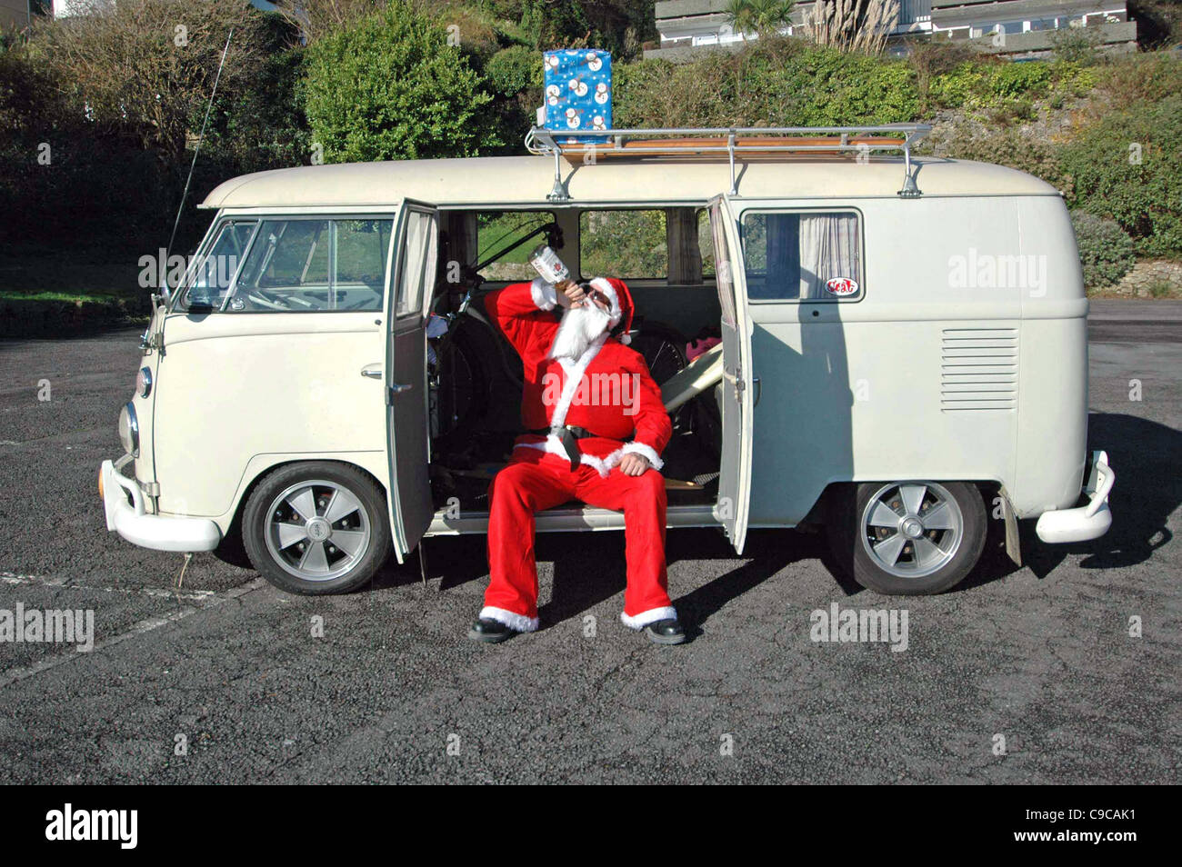 DRUNK SANTA CLAUS SITTING IN VW CAMPER VAN AT LANGLAND BAY NEAR SWANSEA ...