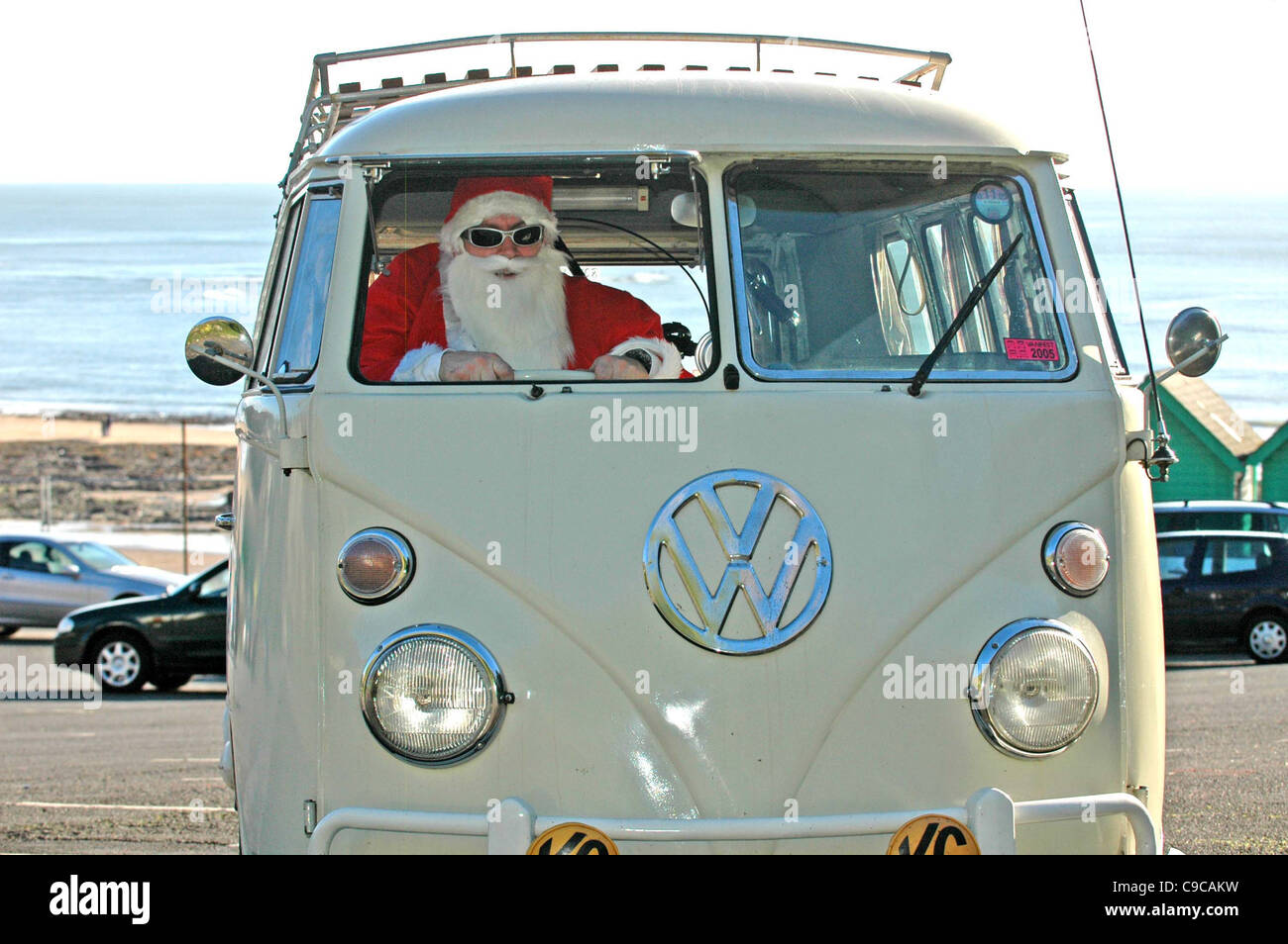 Santa Claus driving a VW split screen camper van Stock Photo - Alamy