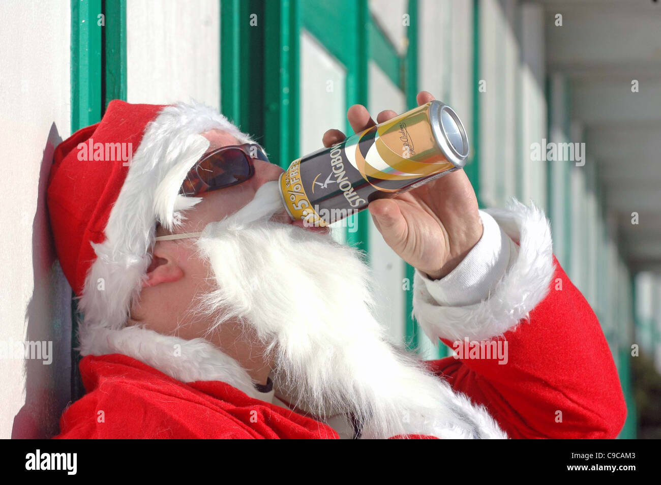 Santa Claus drinking a can of Strongbow cider Stock Photo - Alamy