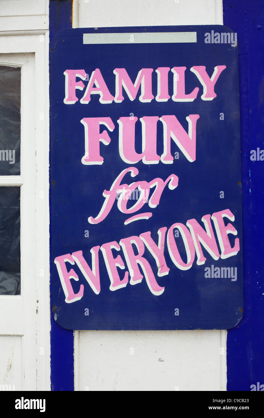 Family fun for everyone sign at pier Stock Photo - Alamy