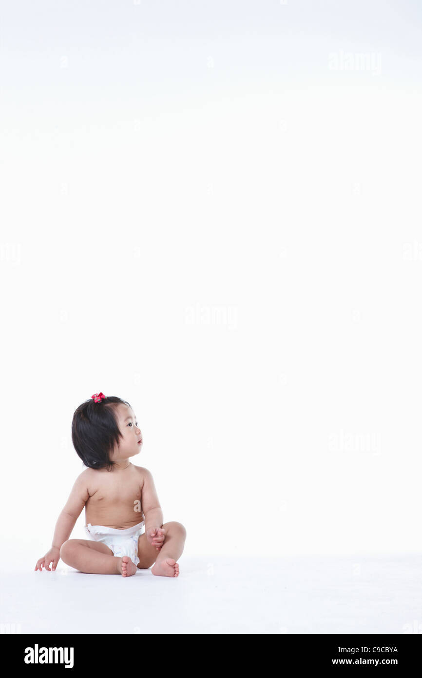 Baby girl in nappy Stock Photo - Alamy