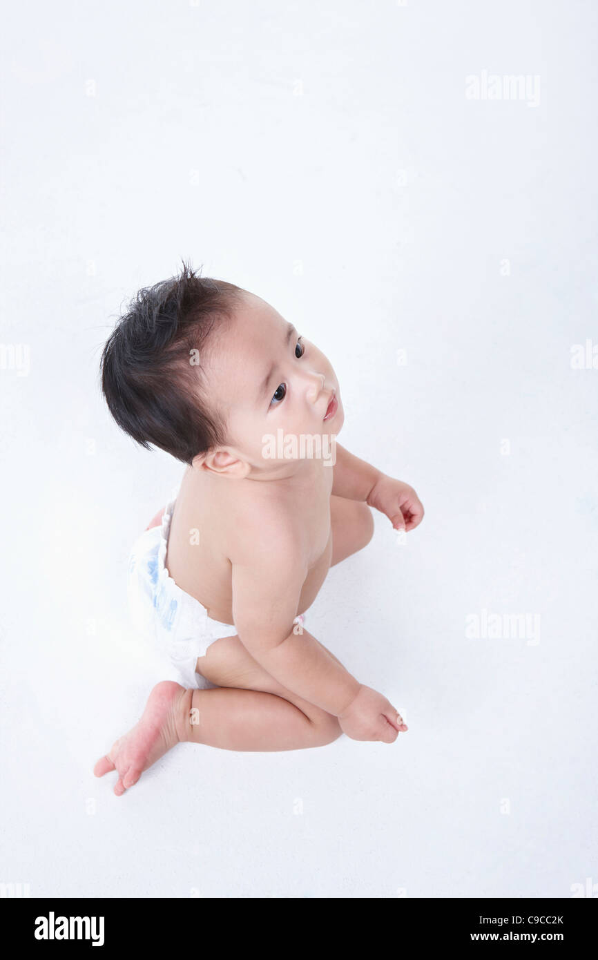 Baby boy in nappy Stock Photo - Alamy