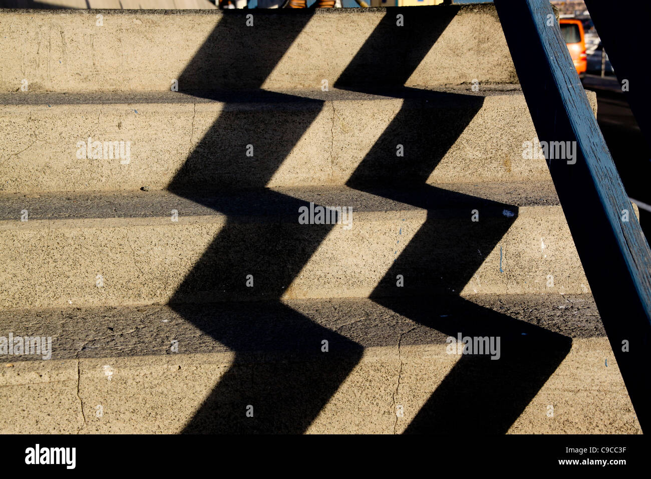 Handrail shadows on concrete steps Stock Photo - Alamy