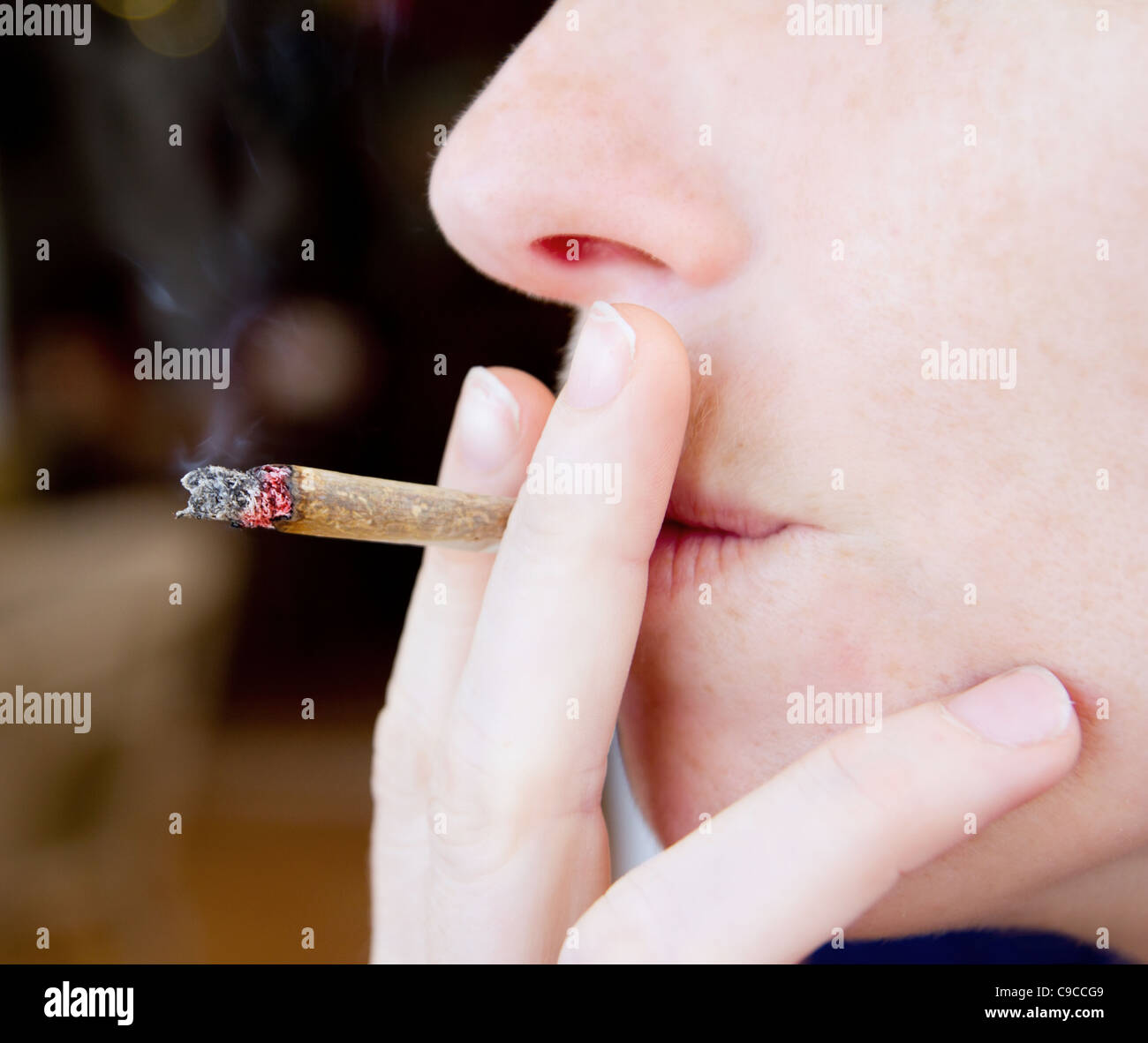 smoking joint closeup with smoke like unhealthy tobacco Stock Photo - Alamy