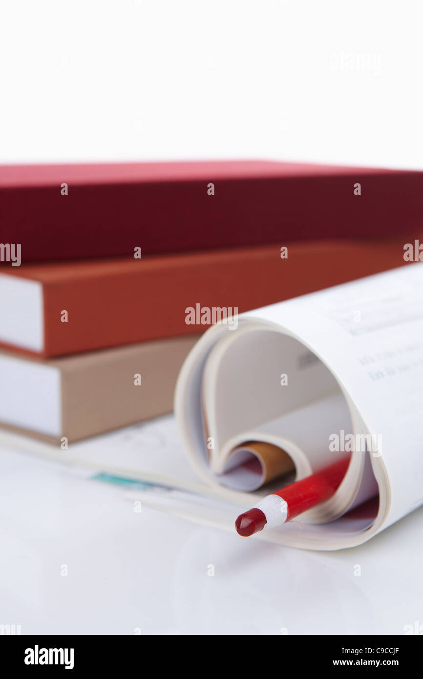 Books and a red color pencil Stock Photo - Alamy