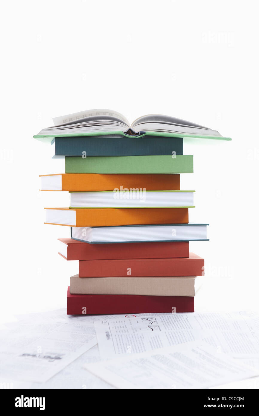 Stacks of books and test papers Stock Photo - Alamy