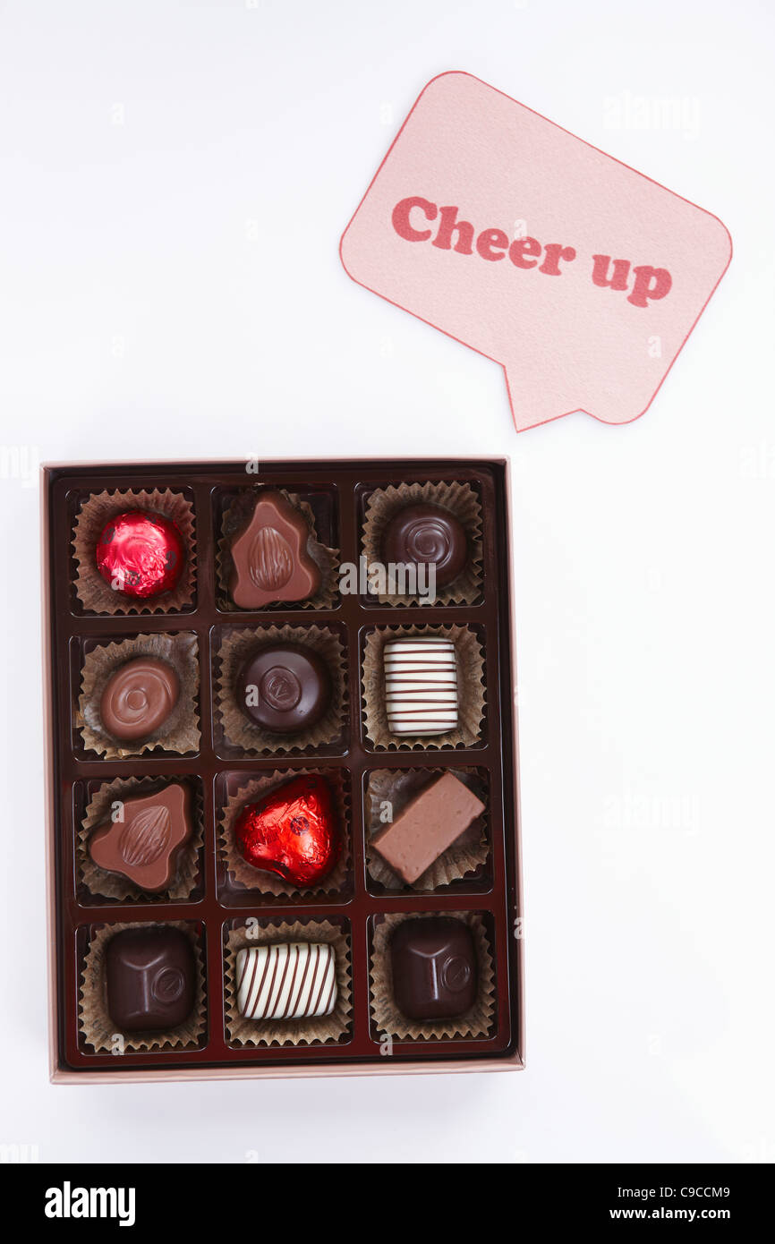 A box of chocolate and cheer up message Stock Photo - Alamy
