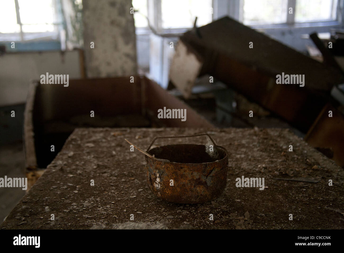 Rusted pot on an equally rusted table in the kitchen of Pripyat Middle ...