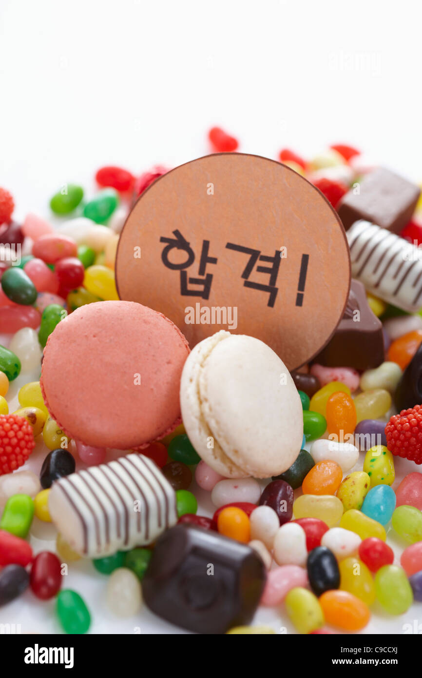 Sweets and a MUST PASS message Stock Photo - Alamy