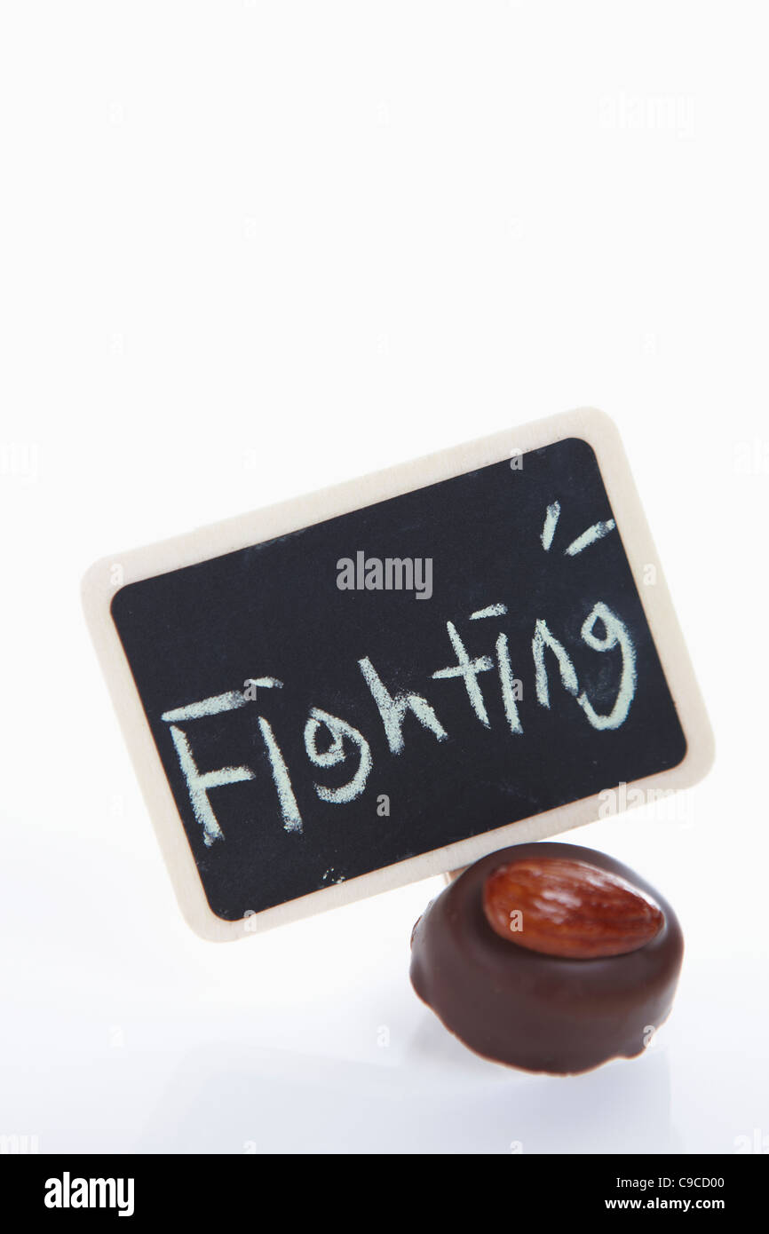 A chocolate with a fighting message board Stock Photo - Alamy