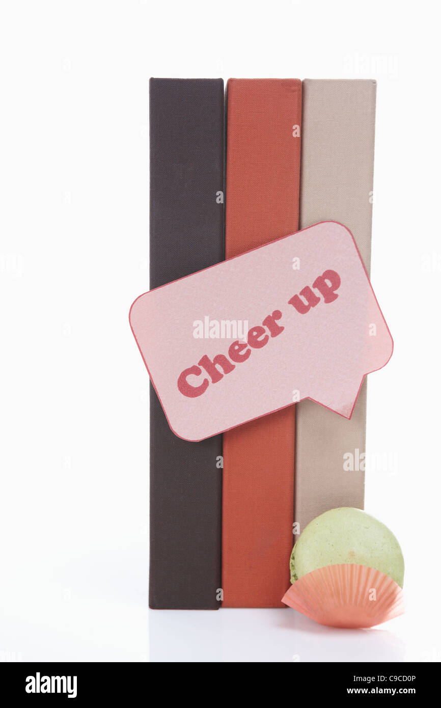 Books with macaron and a cheer up message Stock Photo - Alamy