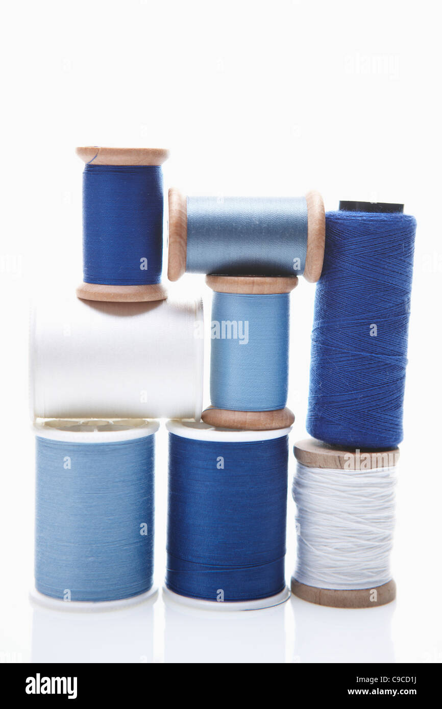 Various reel of threads in blue tone Stock Photo - Alamy
