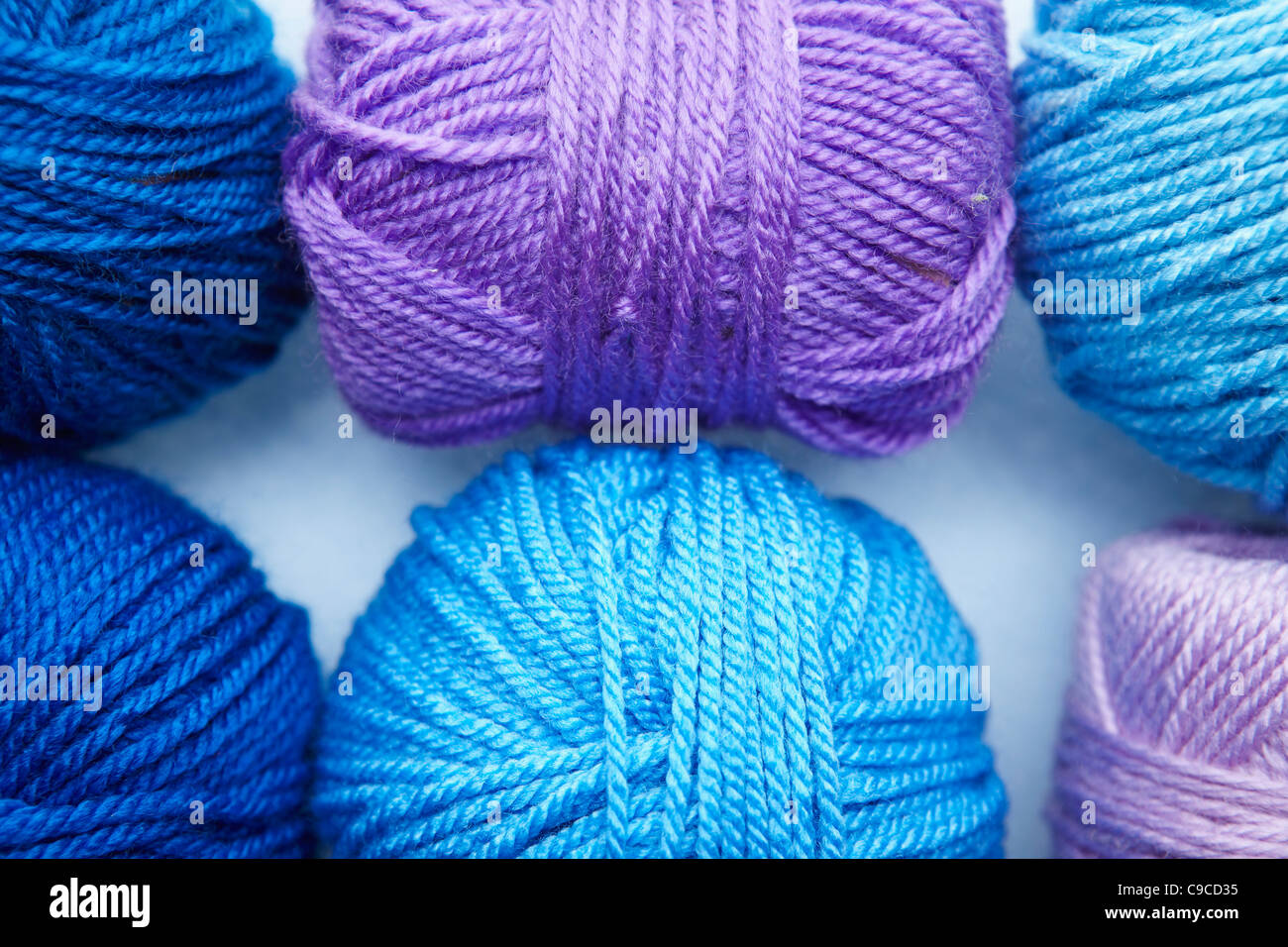 Knitting yarn balls in blue and purple tone Stock Photo - Alamy