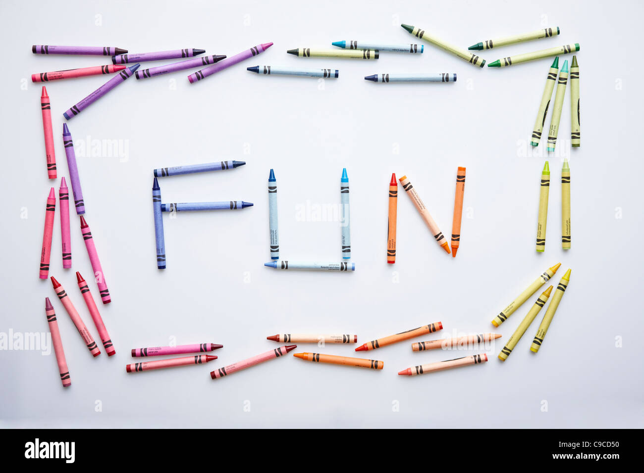 Many crayons in various colors and word FUN Stock Photo - Alamy