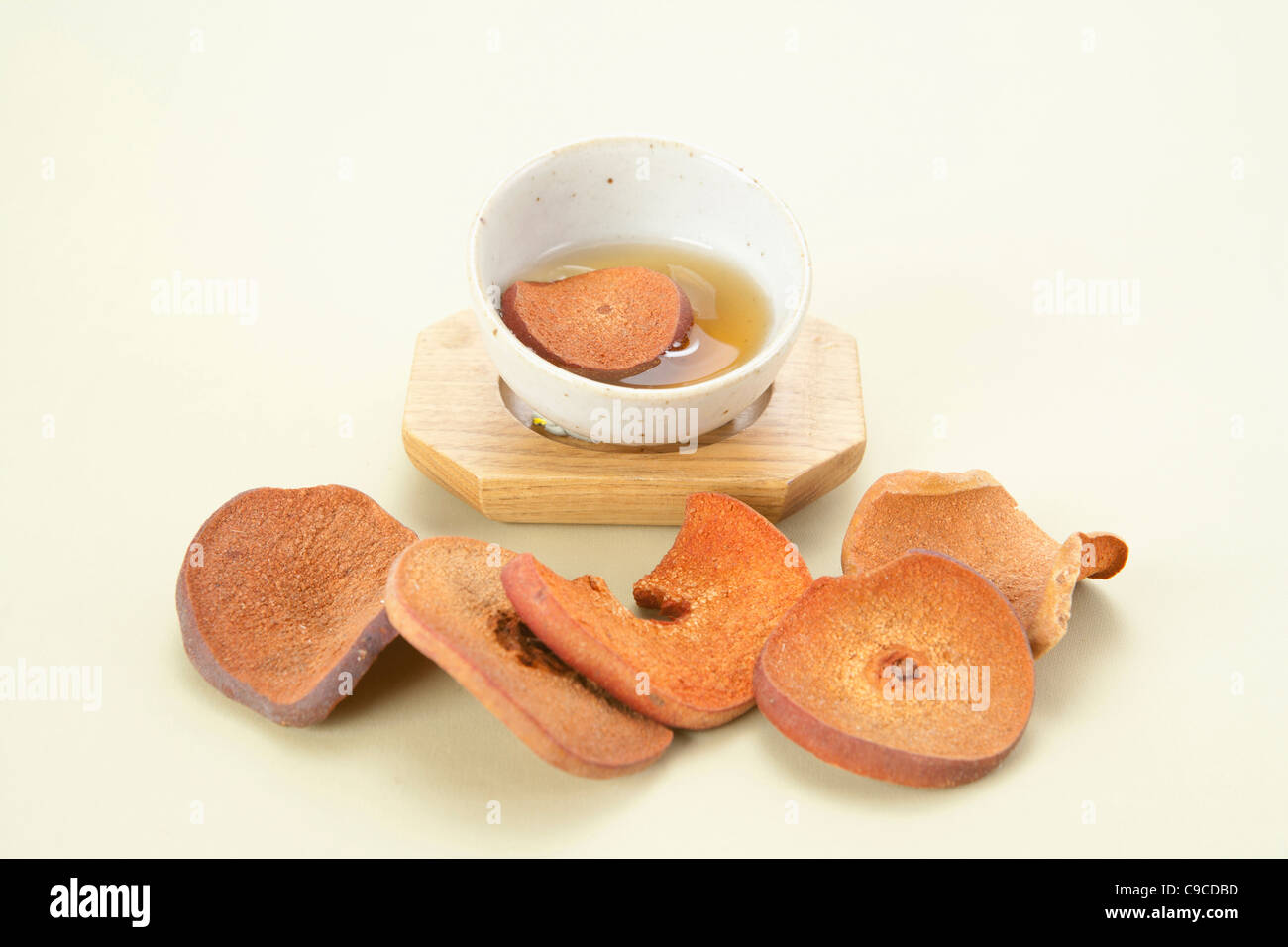 Cup of quince tea and its fruits sliced Stock Photo - Alamy