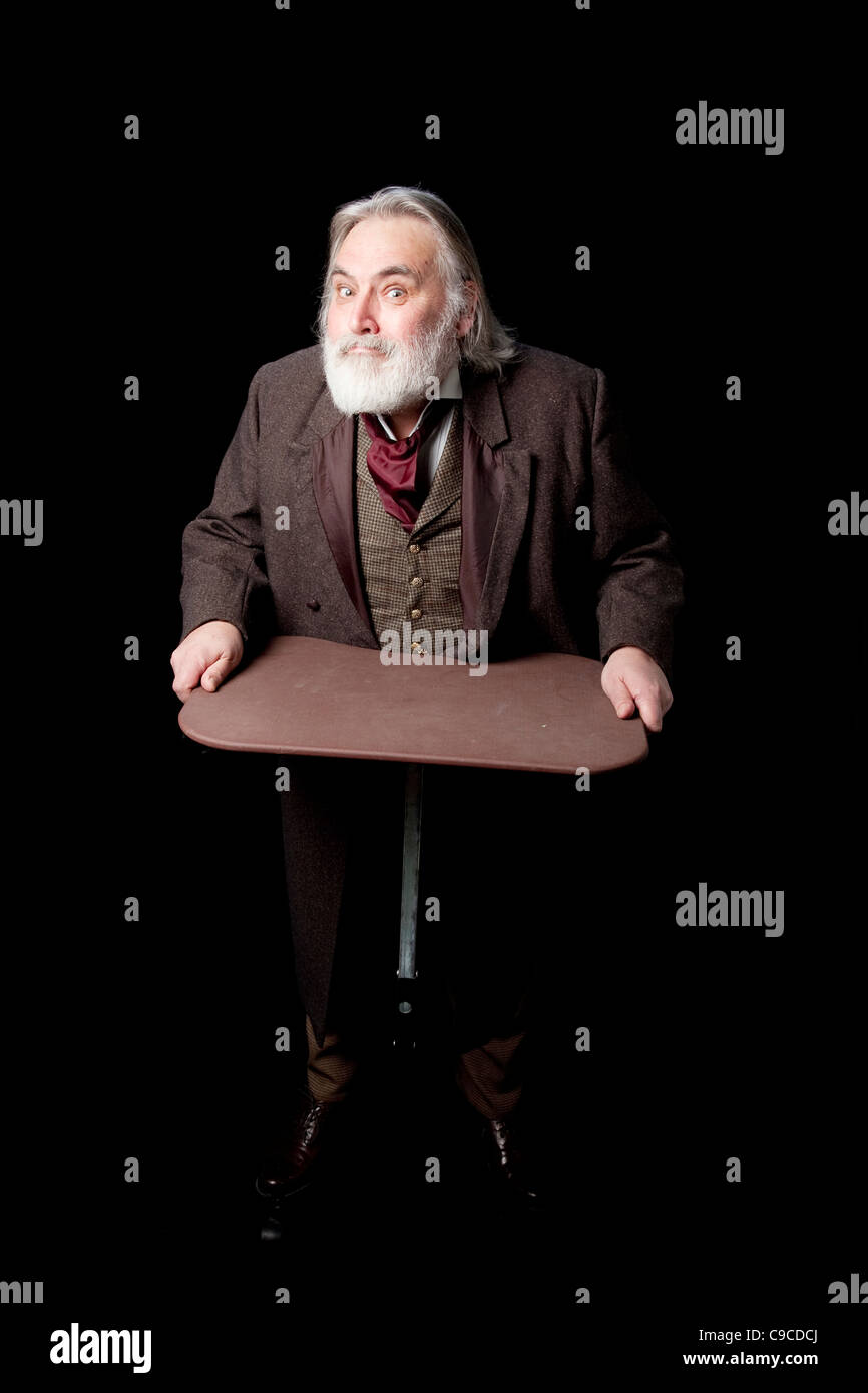 Charles Dickens actor on stag Stock Photo - Alamy