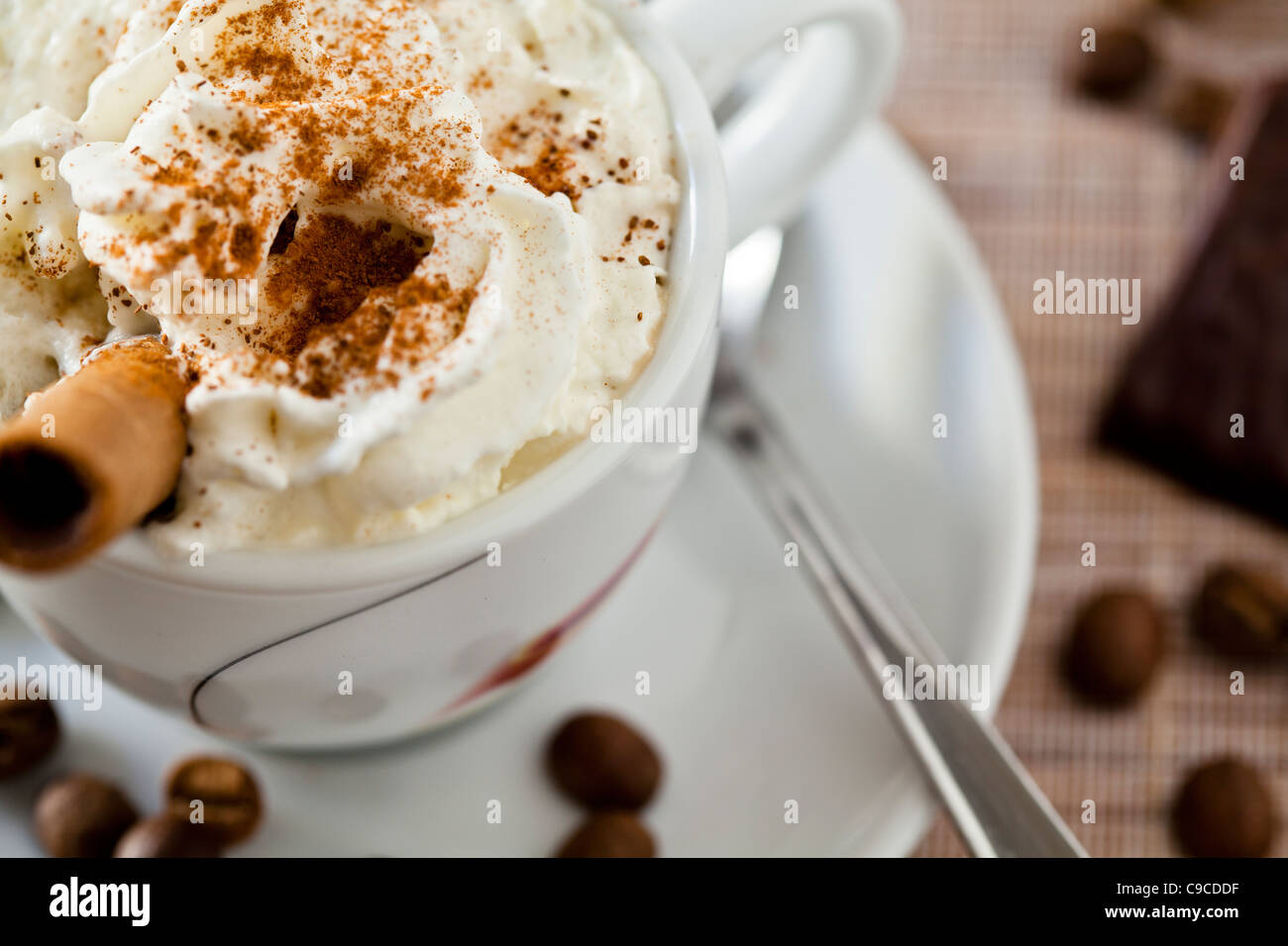 Photograph of a coffee cup with whipped cream and chocolate candy Stock ...