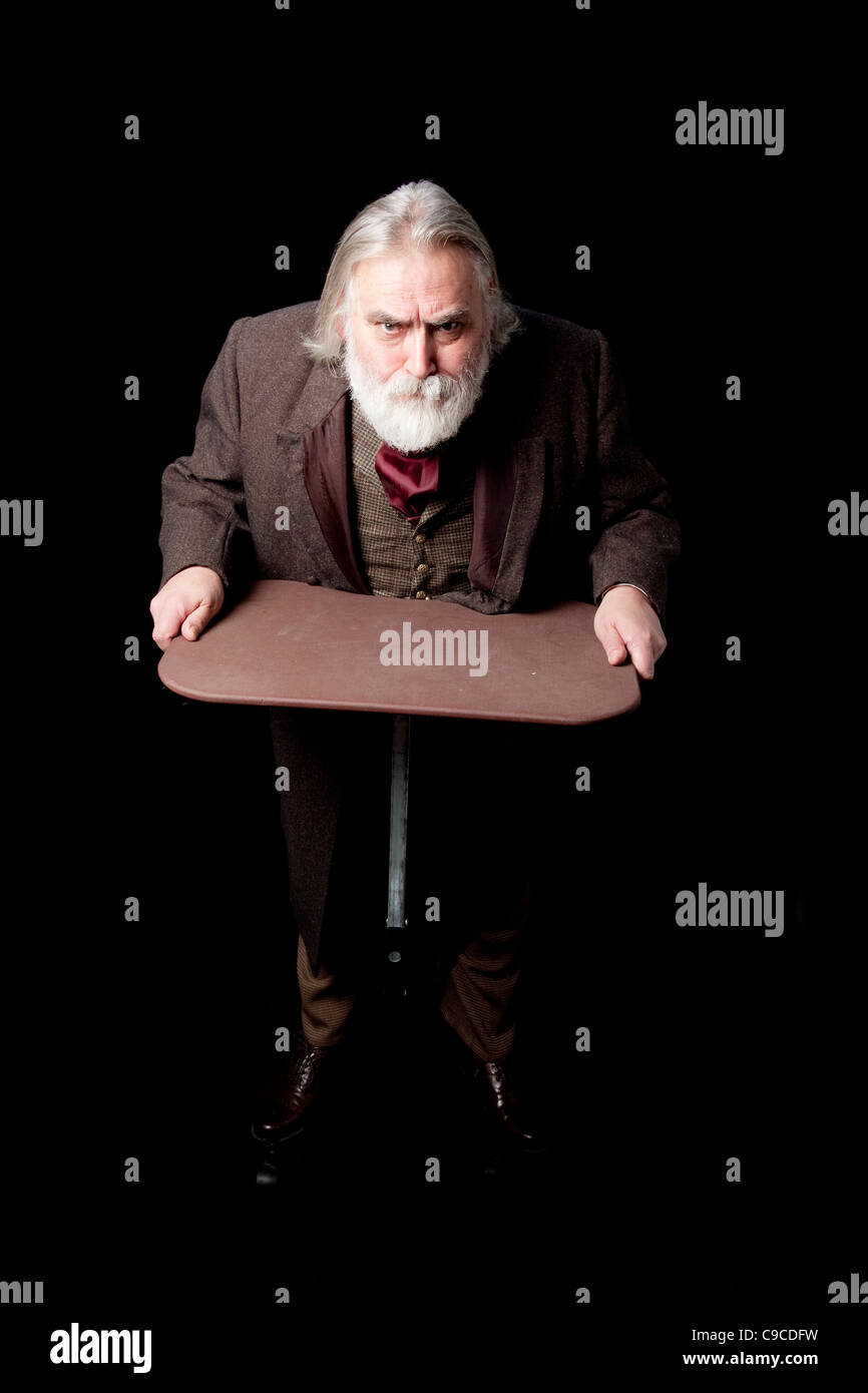 Charles Dickens actor on stag Stock Photo - Alamy