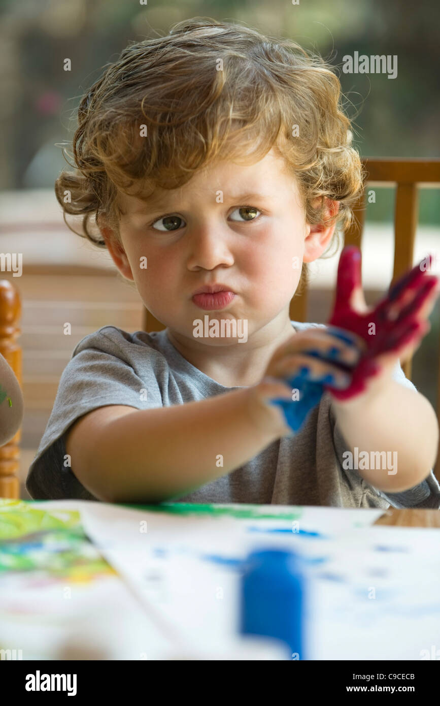 Little boy sulking Stock Photo - Alamy