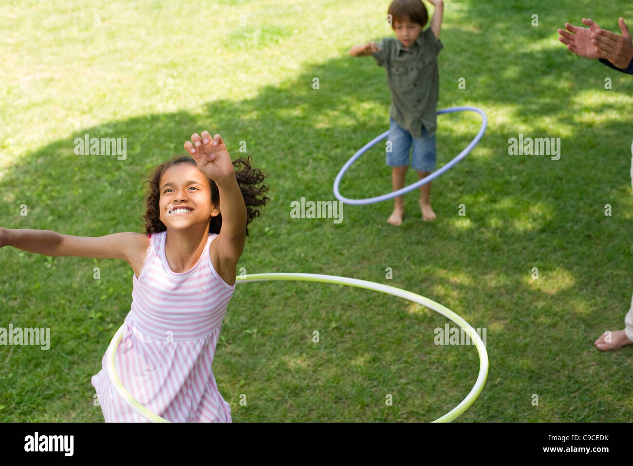 Girls boys hula hoop hi-res stock photography and images - Alamy