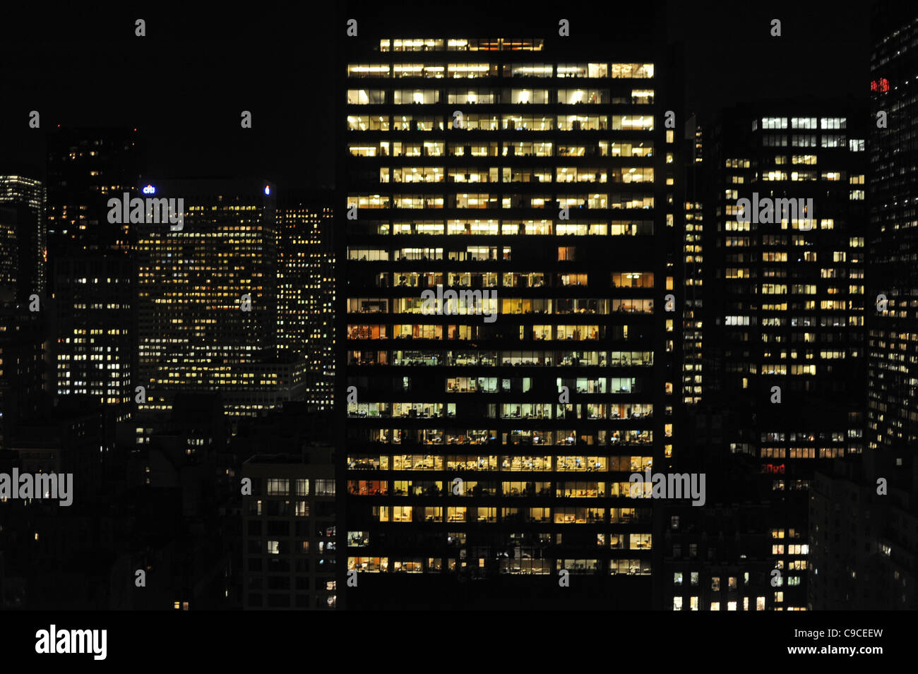 Tower block offices lit up at night near Central Park Manhattan New ...