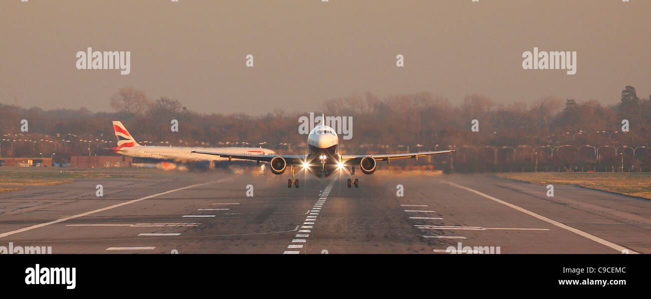 A passenger jet prepares to take off from London Gatwick airport ...
