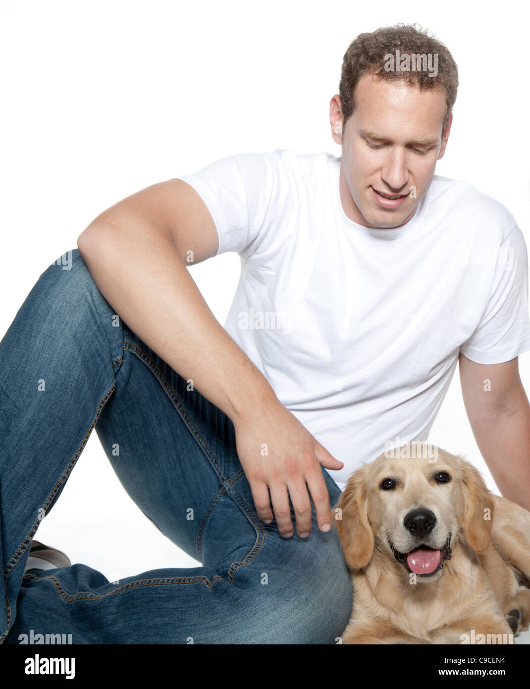 man with dog golden retriever purebred puppy isolated on white Stock ...