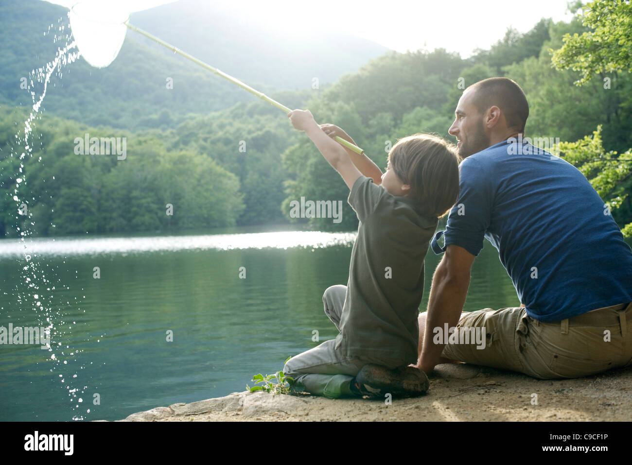 Father kid hold arms back view hi-res stock photography and images - Alamy